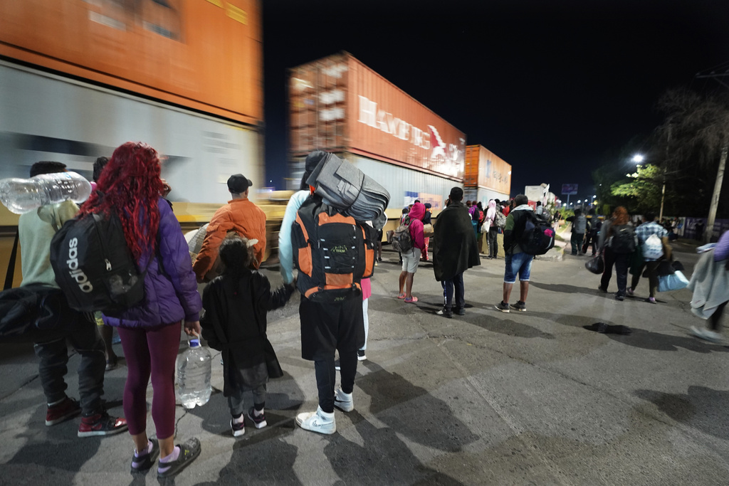 Migrants hoping to reach US continue north through Mexico by train amid ...